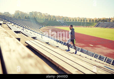 young man running upstairs Stock Photo - Alamy