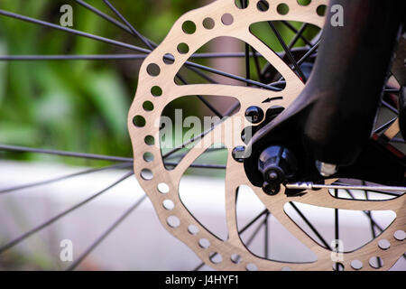 Bicycle disk brakes close up, grey metal disc attached to bike wheel ...