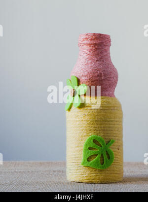 handmade decorated color glass bottle with string Stock Photo - Alamy