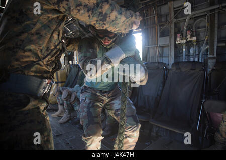 Royal Marines fast roping from a British Royal Navy Merlin HC3 ...