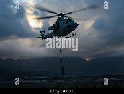SEALs from Naval Special Warfare Group 3 conduct a fast rope operation ...