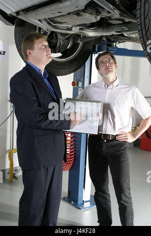 Car dealer, garage, hoist, car, men, underbody inspection garage ...
