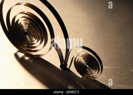 Pair of metal springs on dark background under beam of light Stock ...