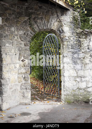 Garden door, stone defensive wall, floral decoration, Germany, Bavaria ...