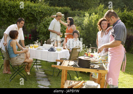Garden party, guests, grill, model released Stock Photo - Alamy