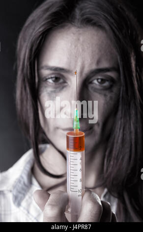 Female drug addict with syringe Stock Photo - Alamy