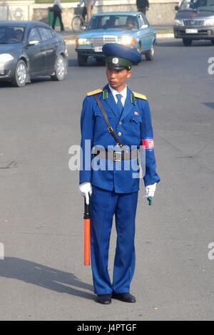 PYONGYANG, North Korea - North Korean police try to put an angry Stock ...