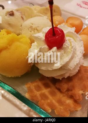 plate of chocolate ice cream scoops on dark background, top view Stock ...