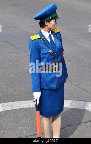 PYONGYANG, North Korea - North Korean police try to put an angry Stock ...