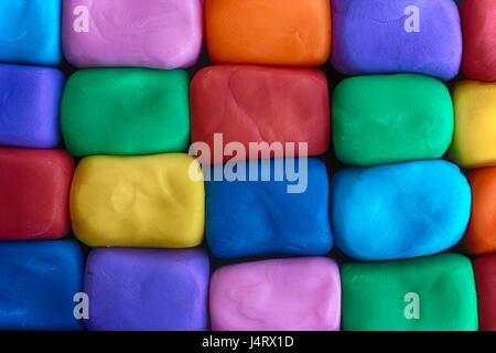 Colorful blocks made out of plasticine. Close up Stock Photo - Alamy