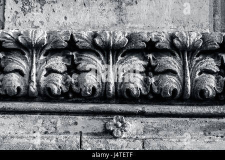 stone curving on vintage wall as background Stock Photo - Alamy