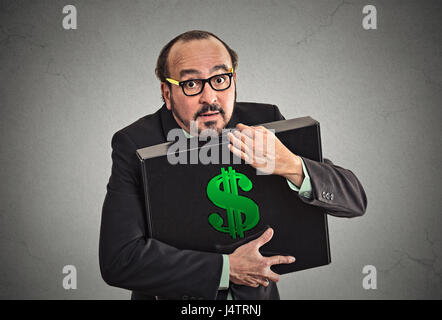 Handsome hispanic man holding dollars calculating savings smiling and ...