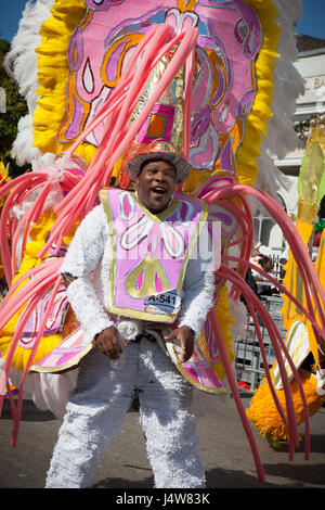 NASSAU, THE BAHAMAS - JANUARY 1 - Male dancer dressed in orange and red ...