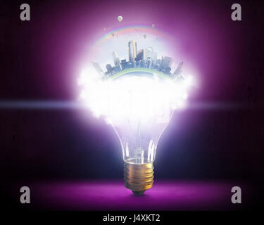 Think green concept with cityscape inside of light bulb Stock Photo - Alamy