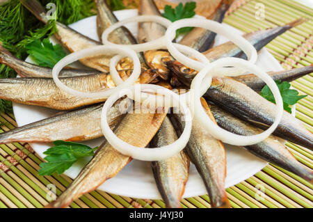 Smoked small fish (kilka, sprat, herring) and beer Stock Photo - Alamy