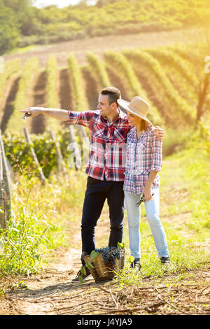 A couple walking between two rows of trees Stock Photo - Alamy
