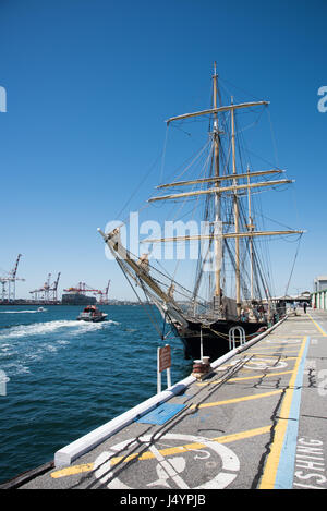 SS Leeuwin II tall ship with dockside warehouses and commercial port in ...