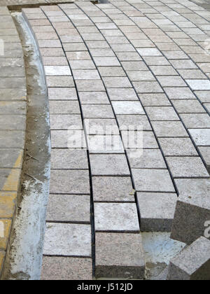 Square paving stones awaiting grouting on slope in Andalusian village ...
