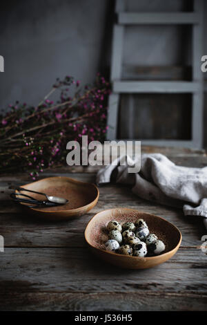 Qualis eggs on a country kitchen table Stock Photo - Alamy