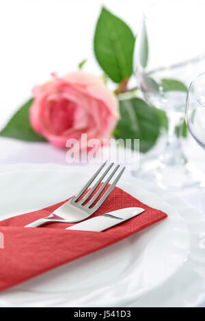 Table setting for Valentine's Day with rose on grey background Stock ...