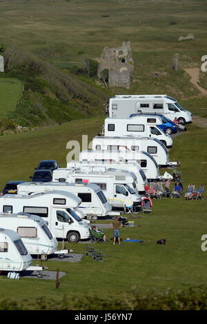 Camper Vans and Caravans in a row on camp site Stock Photo - Alamy
