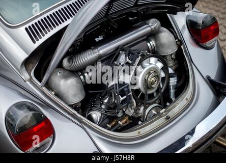 The engine compartment of a VW Beetle is open at the Maikaefertreffen ...