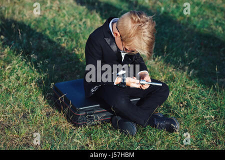 photo of little boy playing secret agent Stock Photo - Alamy