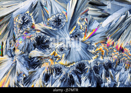 Microscopic view of colorful sucrose crystals. Recrystallized table ...