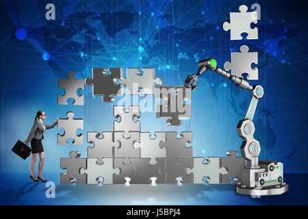 Businesswoman doing jigsaw puzzle with robotic arm Stock Photo - Alamy
