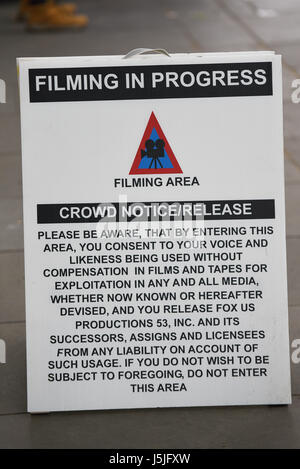 Warning signs in a public place, to parents that photography will be ...