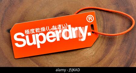 Superdry clothing label logos Stock Photo - Alamy