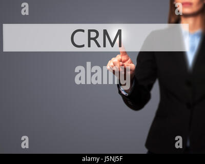 CRM - Female touching virtual button. Business, internet concept. Stock ...