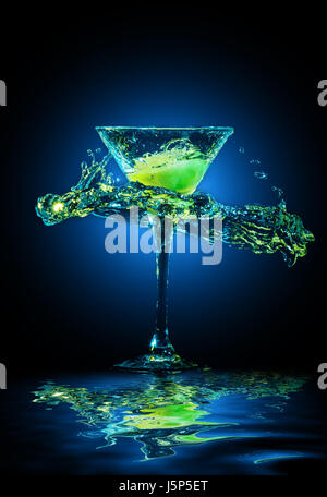 Colourful cocktail in glass with splash Stock Photo - Alamy