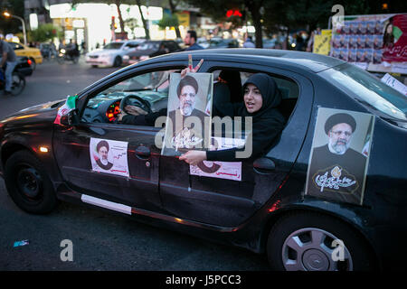 A supporter holds a poster of presidential candidate Ivan Cepeda of the ...