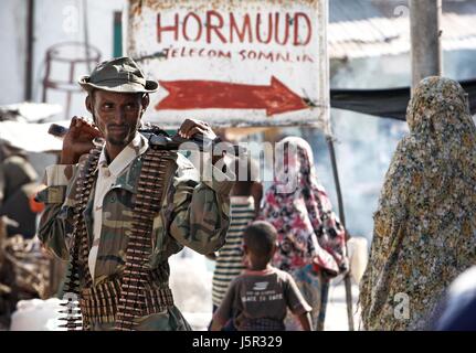 A Somali National Army (SNA) soldier carries a weapon on the frontline ...
