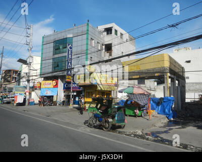 This image highlights a busy intersection in Quezon City, Philippines ...