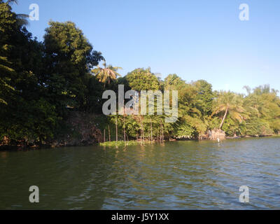 This image shows the construction of riprap along the riverbanks in ...