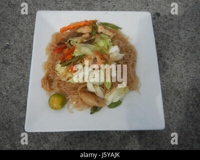 Photograph of Pancit Bulacan, a traditional noodle dish from the ...