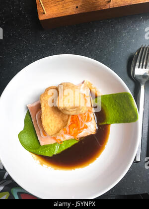 Plate with delicious salmon croquettes on table Stock Photo - Alamy