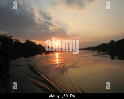 This image depicts the scenic sunsets over paddy and vegetable fields ...