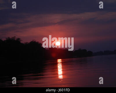 The sunsets over the riverside districts of Calumpit, Bulacan, offer a ...