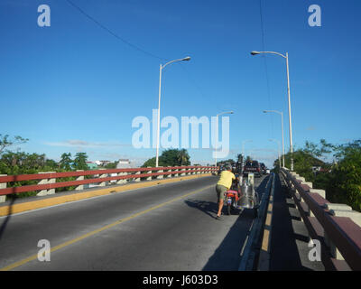 This image depicts the Santa Rosa Bridge in Pasig City, Philippines. It ...