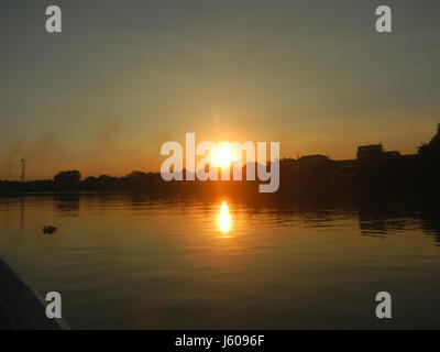 This photograph captures the scenic riverside districts of Calumpit ...