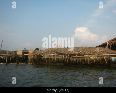 This image features the Malolos River in Bulacan, Philippines ...