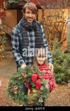 Portrait of a Young Girl with her Father at Christmas Stock Photo - Alamy