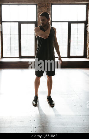 Full length portrait of healthy young african man exercising on the ...