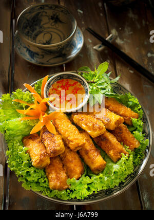 Vietnamese stuffed green nem spring rolls in leaf Stock Photo - Alamy