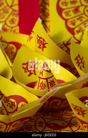 People burn joss paper money as offering to ancestors ahead of the ...