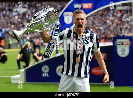 Millwall's Steve Morison celebrates with the trophy on the pitch after ...