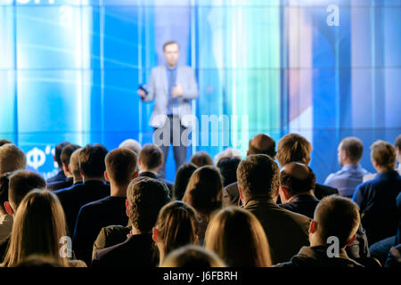 Audience at the conference hall listens to lecturer, people on a ...